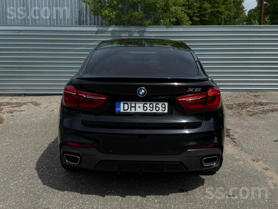 Black BMW X6 2018 in Riga, with an engine capacity of 3.00 L and mileage of 137 thousand km for 29699 €, photo 9 on AUTOMOTO.COM.LV