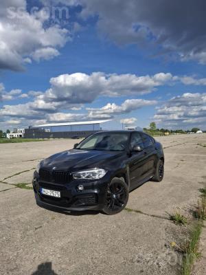 Black BMW X6 2019 in Riga, with an engine capacity of 3.00 L and mileage of 149 thousand km for 32750 €, photo 6 on AUTOMOTO.COM.LV
