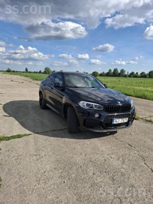 Black BMW X6 2019 in Riga, with an engine capacity of 3.00 L and mileage of 149 thousand km for 32750 €, photo 7 on AUTOMOTO.COM.LV