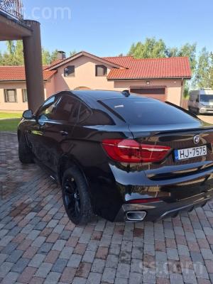 Black BMW X6 2019 in Riga, with an engine capacity of 3.00 L and mileage of 149 thousand km for 32750 €, photo 9 on AUTOMOTO.COM.LV