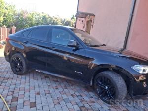 Black BMW X6 2019 in Riga, with an engine capacity of 3.00 L and mileage of 149 thousand km for 32750 €, photo 10 on AUTOMOTO.COM.LV