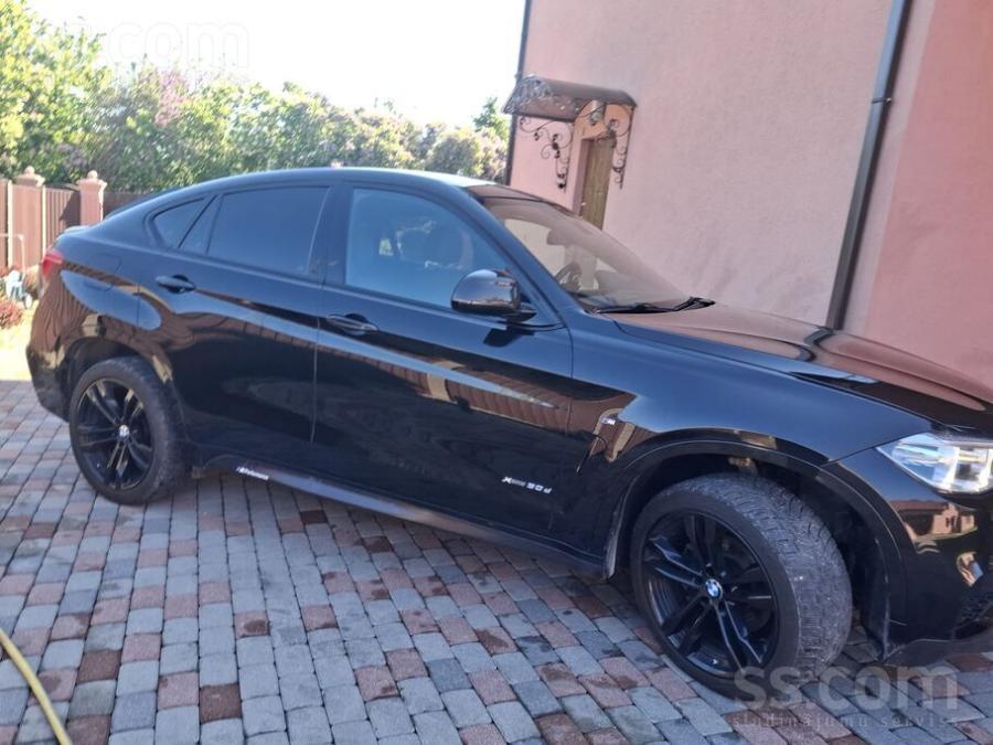 Black BMW X6 2019 in Riga, with an engine capacity of 3.00 L and mileage of 149 thousand km for 32750 €, photo 10 on AUTOMOTO.COM.LV