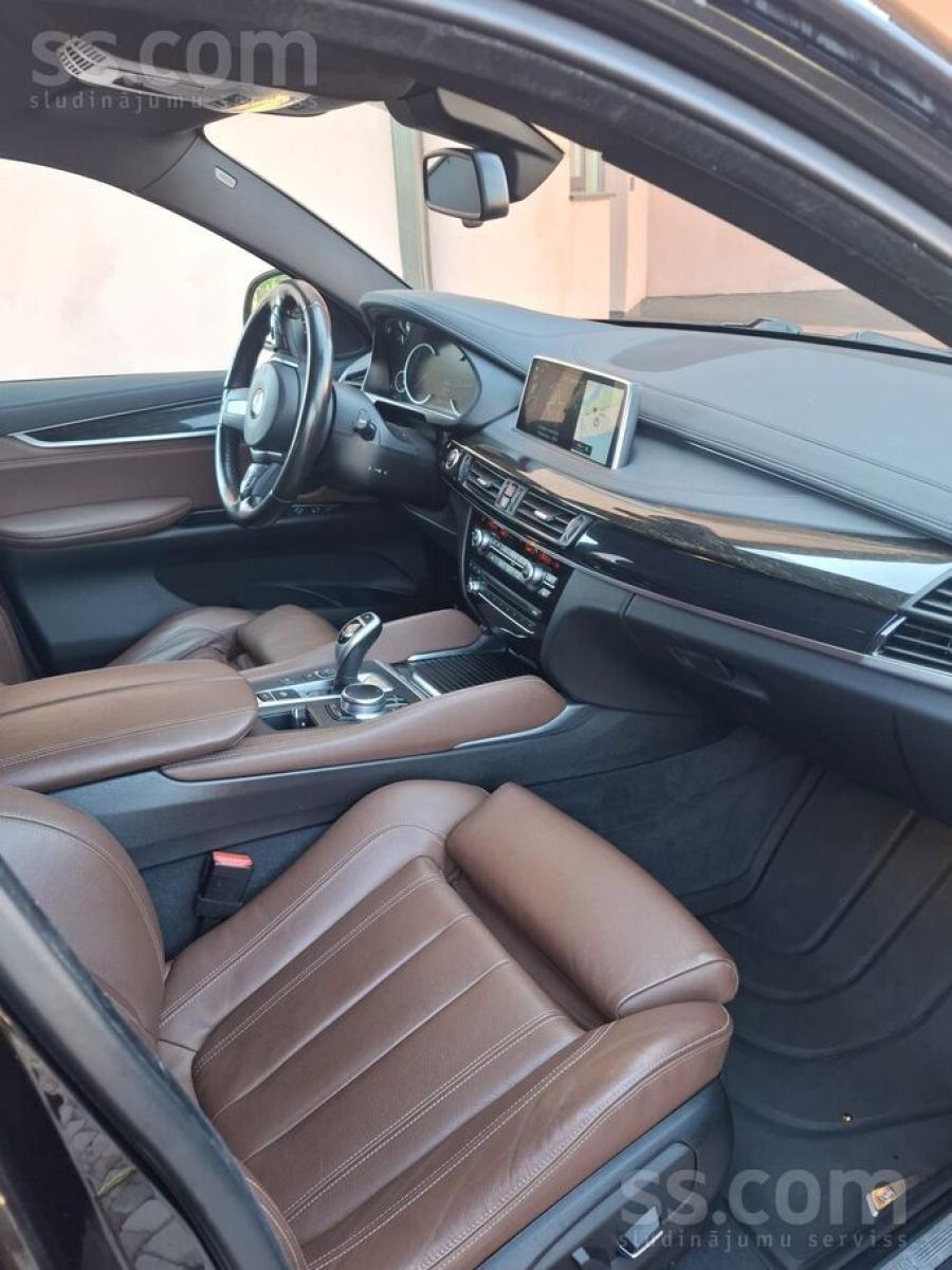 Black BMW X6 2019 in Riga, with an engine capacity of 3.00 L and mileage of 149 thousand km for 32750 €, photo 12 on AUTOMOTO.COM.LV