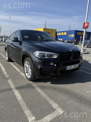 Black BMW X6 2019 in Riga, with an engine capacity of 3.00 L and mileage of 103 thousand km for 36500 €, photo  on AUTOMOTO.COM.LV