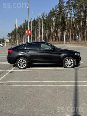 Black BMW X6 2019 in Riga, with an engine capacity of 3.00 L and mileage of 103 thousand km for 36500 €, photo 3 on AUTOMOTO.COM.LV