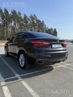 Black BMW X6 2019 in Riga, with an engine capacity of 3.00 L and mileage of 103 thousand km for 36500 €, photo 5 on AUTOMOTO.COM.LV