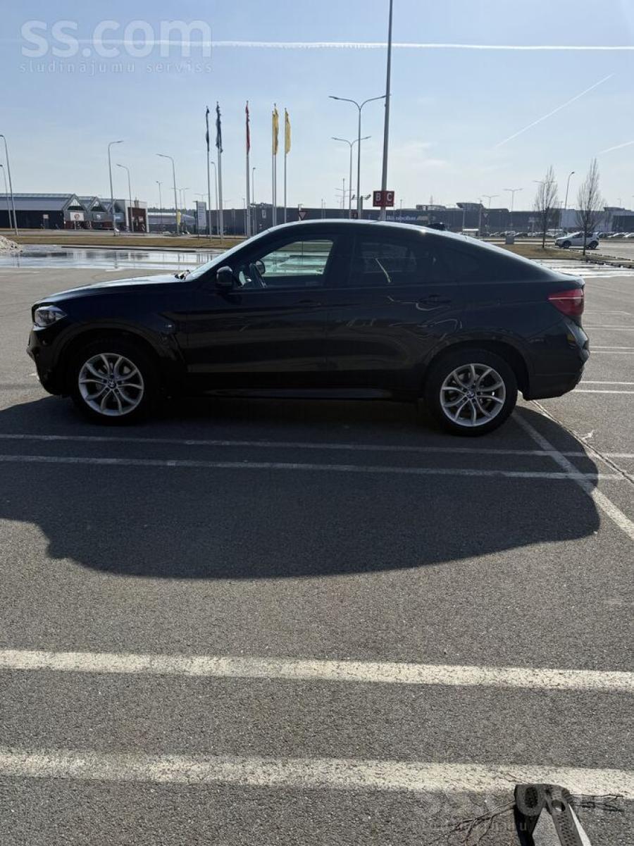 Black BMW X6 2019 in Riga, with an engine capacity of 3.00 L and mileage of 103 thousand km for 36500 €, photo 6 on AUTOMOTO.COM.LV