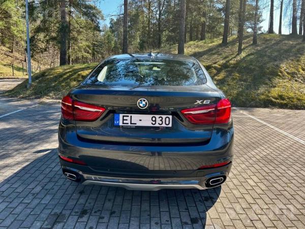 Black BMW X6 2019 in Riga, with an engine capacity of 3.00 L and mileage of 67 thousand km for 31500 €, photo 2 on AUTOMOTO.COM.LV