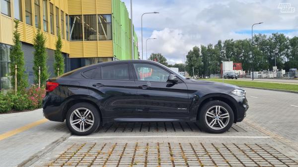 Black BMW X6 2019 in Vilnius, with an engine capacity of 3.00 L and mileage of 194 thousand km for 31900 €, photo 6 on AUTOMOTO.COM.LV