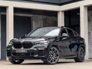 Black BMW X6 2020 in Riga, with an engine capacity of 3.00 L and mileage of 92 thousand km for 55900 €, photo 4 on AUTOMOTO.COM.LV