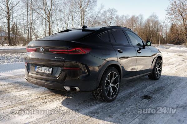Melns BMW X6 2021 Tartu, ar dzinēja tilpumu 3.00 L un nobraukumu 129 tūkst. km par 58000 €, foto 4 vietnē AUTOMOTO.COM.LV