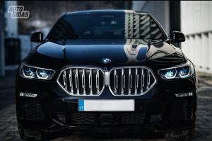Black BMW X6 2021 in Vilnius, with an engine capacity of 3.00 L and mileage of 106 thousand km for 60499 €, photo 3 on AUTOMOTO.COM.LV