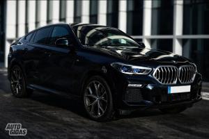 Black BMW X6 2021 in Vilnius, with an engine capacity of 3.00 L and mileage of 106 thousand km for 60499 €, photo 4 on AUTOMOTO.COM.LV