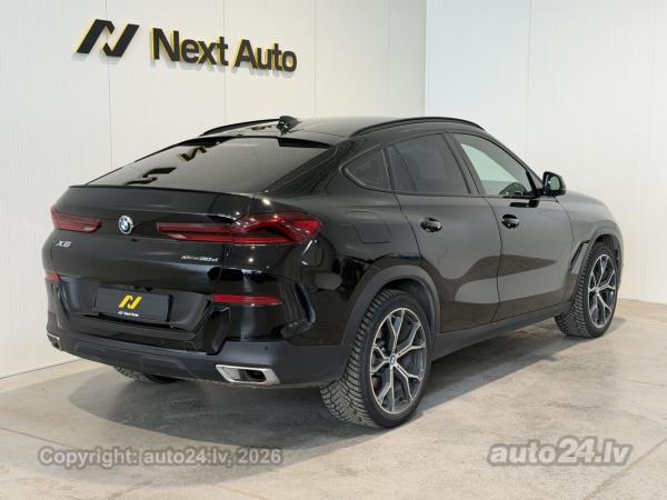 Black BMW X6 2021 in Tartu, with an engine capacity of 3.00 L and mileage of 129 thousand km for 58000 €, photo 2 on AUTOMOTO.COM.LV