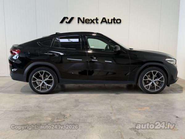 Black BMW X6 2021 in Tartu, with an engine capacity of 3.00 L and mileage of 129 thousand km for 58000 €, photo 4 on AUTOMOTO.COM.LV