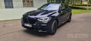 Black BMW X6 2021 in Riga, with an engine capacity of 3.00 L and mileage of 85 thousand km for 59500 €, photo  on AUTOMOTO.COM.LV