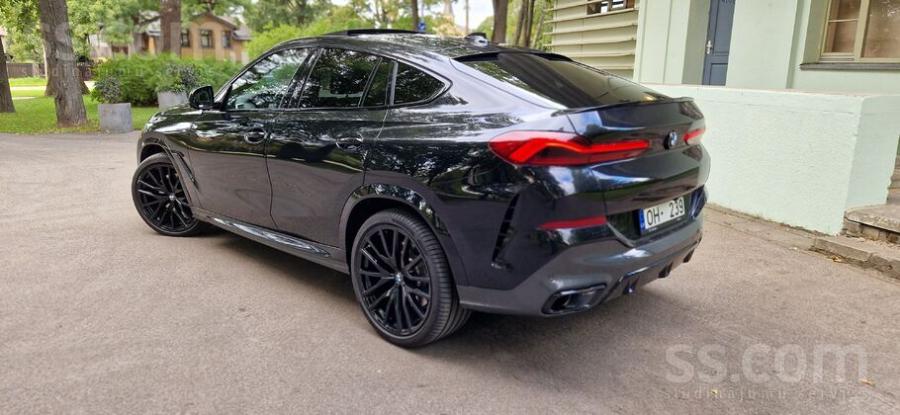 Black BMW X6 2021 in Riga, with an engine capacity of 3.00 L and mileage of 85 thousand km for 59500 €, photo 4 on AUTOMOTO.COM.LV