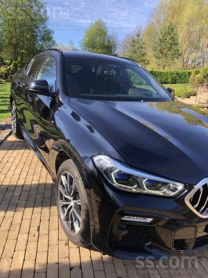 Black BMW X6 2021 in Cesis, with an engine capacity of 3.00 L and mileage of 122 thousand km for 53750 €, photo  on AUTOMOTO.COM.LV