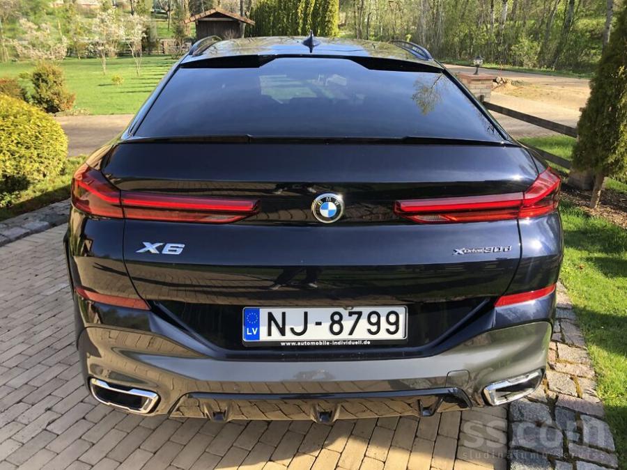 Black BMW X6 2021 in Cesis, with an engine capacity of 3.00 L and mileage of 122 thousand km for 53750 €, photo 5 on AUTOMOTO.COM.LV