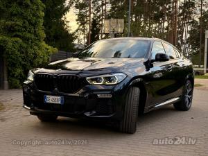 Black BMW X6 2021 in Riga, with an engine capacity of 3.00 L and mileage of 206 thousand km for 48850 €, photo  on AUTOMOTO.COM.LV