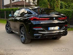 Black BMW X6 2021 in Riga, with an engine capacity of 3.00 L and mileage of 206 thousand km for 48850 €, photo 3 on AUTOMOTO.COM.LV
