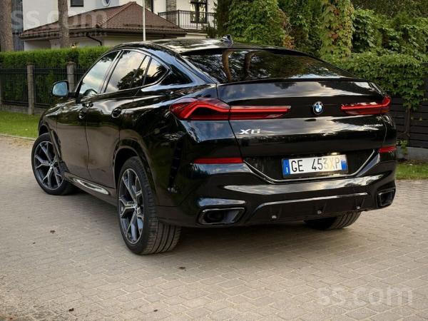 Black BMW X6 2021 in Riga, with an engine capacity of 3.00 L and mileage of 206 thousand km for 49850 €, photo 4 on AUTOMOTO.COM.LV