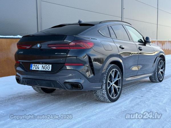 Black BMW X6 2022 in Tallinn, with an engine capacity of 3.00 L and mileage of 91 thousand km for 59900 €, photo 2 on AUTOMOTO.COM.LV