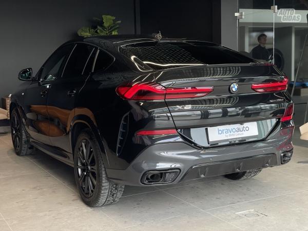 Black BMW X6 2022 in Klaipeda, with an engine capacity of 3.00 L and mileage of 89 thousand km for 58991 €, photo 6 on AUTOMOTO.COM.LV
