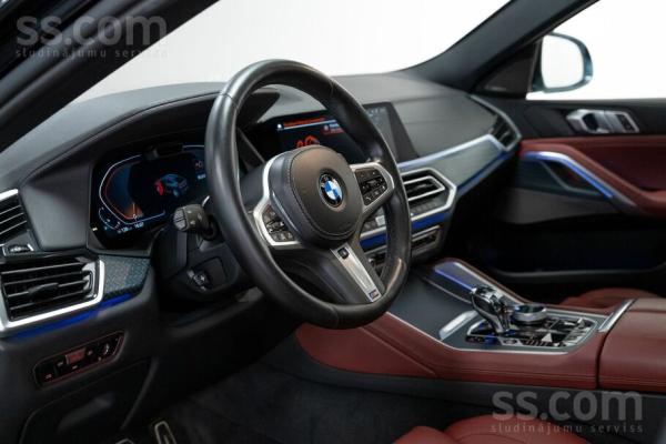 Black BMW X6 2022 in Riga, with an engine capacity of 3.00 L and mileage of 79 thousand km for 57500 €, photo 11 on AUTOMOTO.COM.LV