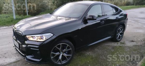 Black BMW X6 2023 in Riga, with an engine capacity of 3.00 L and mileage of 42 thousand km for 59640 €, photo 9 on AUTOMOTO.COM.LV