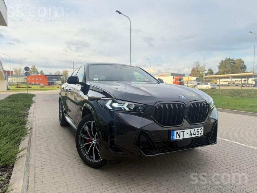 Black BMW X6 2024 in Rezekne, with an engine capacity of 3.00 L and mileage of 53 thousand km for 78600 €, photo 2 on AUTOMOTO.COM.LV