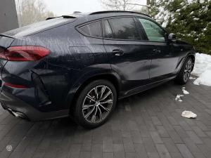 Black BMW X6 2024 in Kaunas, with an engine capacity of 2.99 L and mileage of 24 thousand km for 93500 €, photo 1 on AUTOMOTO.COM.LV