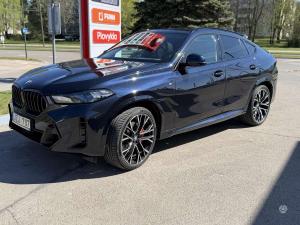 Black BMW X6 2024 in Kazlu Ruda, with an engine capacity of 3.00 L and mileage of 31 thousand km for 89500 €, photo  on AUTOMOTO.COM.LV