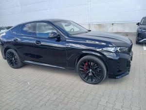Black BMW X6 2024 in Vilnius, with an engine capacity of 2.99 L and mileage of 66 thousand km for 81615 €, photo 4 on AUTOMOTO.COM.LV