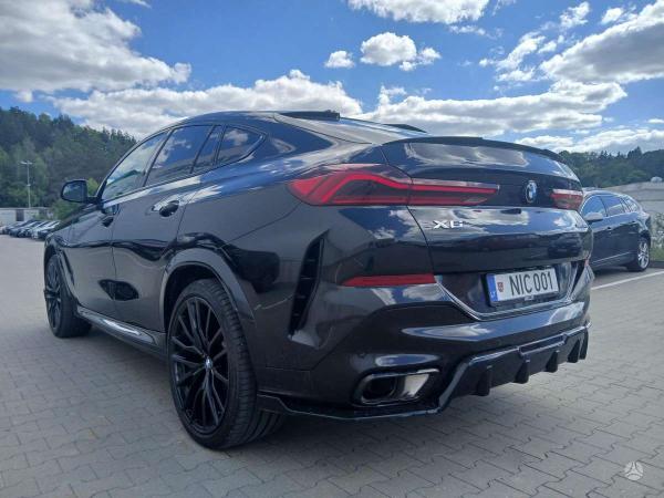 Black BMW X6 2024 in Vilnius, with an engine capacity of 2.99 L and mileage of 66 thousand km for 81615 €, photo 6 on AUTOMOTO.COM.LV