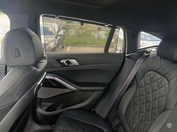 Black BMW X6 2024 in Vilnius, with an engine capacity of 2.99 L and mileage of 66 thousand km for 81615 €, photo 8 on AUTOMOTO.COM.LV