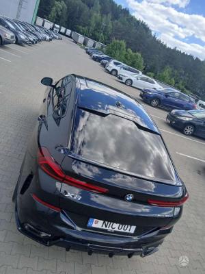 Black BMW X6 2024 in Vilnius, with an engine capacity of 2.99 L and mileage of 66 thousand km for 81615 €, photo 18 on AUTOMOTO.COM.LV