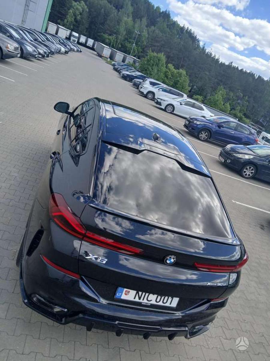 Black BMW X6 2024 in Vilnius, with an engine capacity of 2.99 L and mileage of 66 thousand km for 81615 €, photo 18 on AUTOMOTO.COM.LV