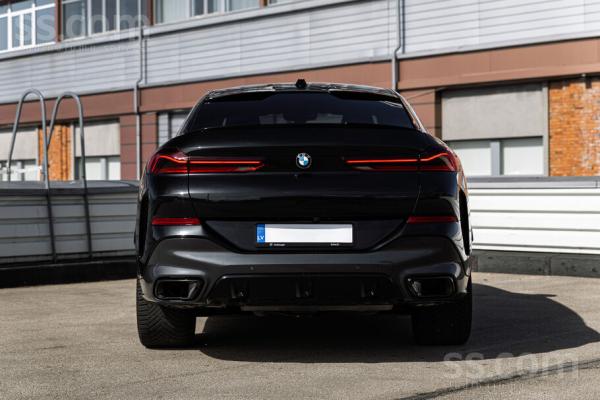 Black BMW X6 2025 in Riga, with an engine capacity of 3.00 L and mileage of 19 thousand km for 87000 €, photo 7 on AUTOMOTO.COM.LV