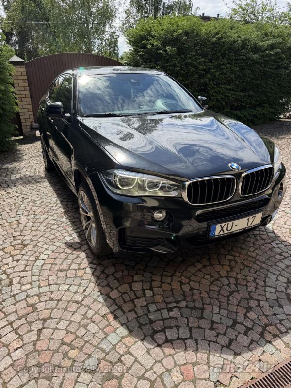Black BMW X6 2015 in Riga, with an engine capacity of 3.00 L and mileage of 283 thousand km for 22000 €, photo 8 on AUTOMOTO.COM.LV