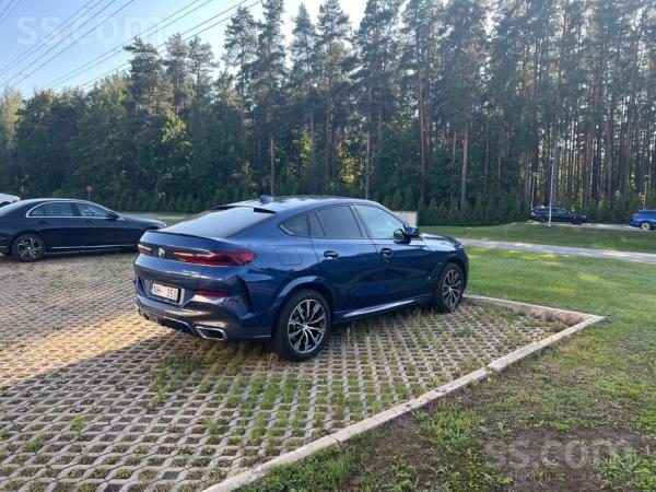 Blue BMW X6 2022 in Riga, with an engine capacity of 3.00 L and mileage of 73 thousand km for 61000 €, photo 1 on AUTOMOTO.COM.LV