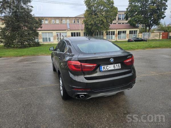 Brown BMW X6 2015 in Riga, with an engine capacity of 3.00 L and mileage of 231 thousand km for 17900 €, photo 4 on AUTOMOTO.COM.LV