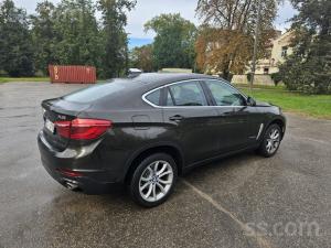 Brown BMW X6 2015 in Riga, with an engine capacity of 3.00 L and mileage of 231 thousand km for 17900 €, photo 8 on AUTOMOTO.COM.LV