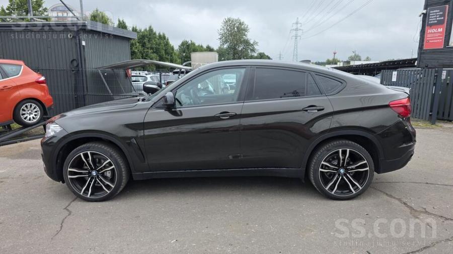 Brown BMW X6 2016 in Riga, with an engine capacity of 3.00 L and mileage of 181 thousand km for 24990 €, photo 9 on AUTOMOTO.COM.LV