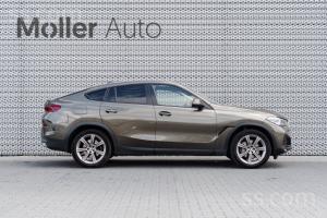 Brown BMW X6 2021 in Riga, with an engine capacity of 3.00 L and mileage of 104 thousand km for 56050 €, photo 6 on AUTOMOTO.COM.LV