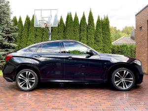 Black BMW X6 M 2015 in Siauliai, with an engine capacity of 2.99 L and mileage of 230 thousand km for 25800 €, photo 7 on AUTOMOTO.COM.LV