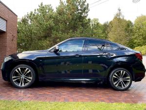 Black BMW X6 M 2015 in Siauliai, with an engine capacity of 2.99 L and mileage of 230 thousand km for 25800 €, photo 9 on AUTOMOTO.COM.LV