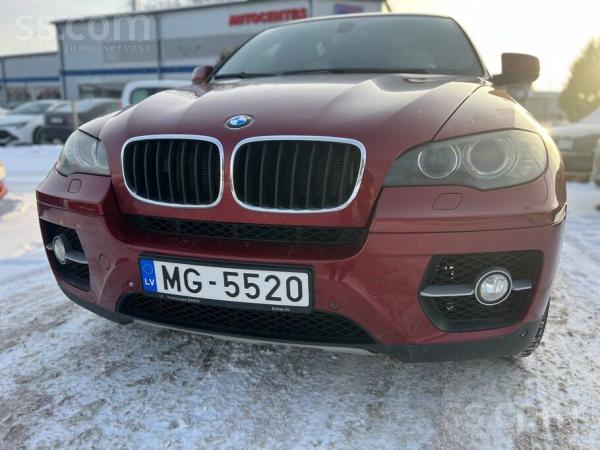 Red BMW X6 2008 in Riga, with an engine capacity of 3.00 L and mileage of 325 thousand km for 7990 €, photo 5 on AUTOMOTO.COM.LV