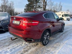 Red BMW X6 2008 in Riga, with an engine capacity of 3.00 L and mileage of 325 thousand km for 7990 €, photo 3 on AUTOMOTO.COM.LV