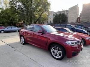 Red BMW X6 2018 in Riga, with an engine capacity of 3.00 L and mileage of 145 thousand km for 28500 €, photo 4 on AUTOMOTO.COM.LV